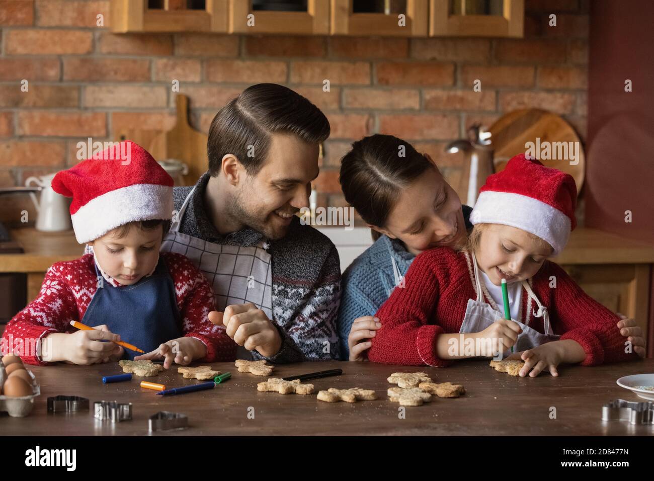 Happy family with kids baking cookies in kitchen Stock Photo - Alamy