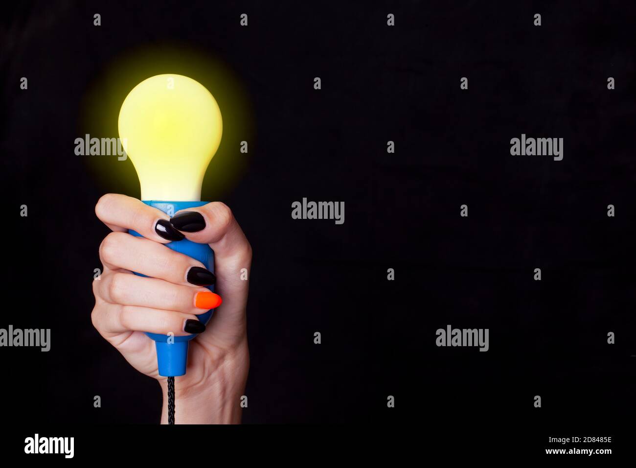 Woman holding light bulb in hi-res stock photography and images - Alamy