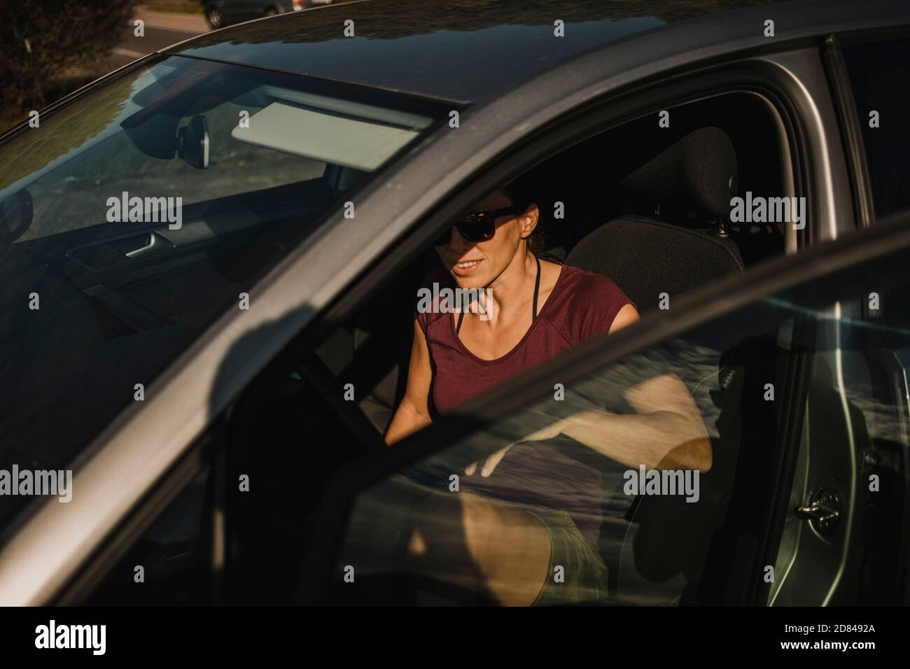 Woman entering a car hi-res stock photography and images - Alamy