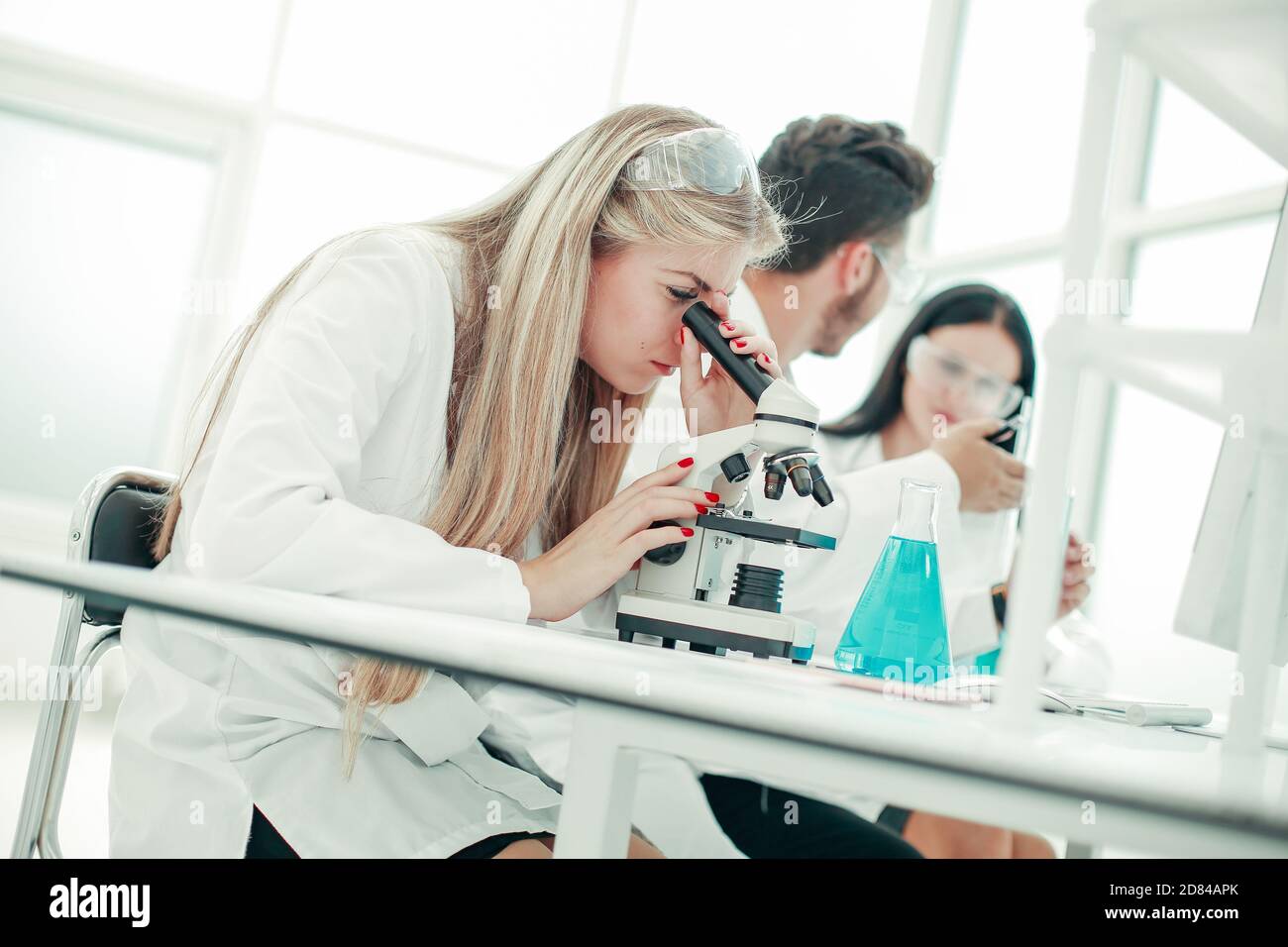 close up. a group of scientists conduct research in a modern lab Stock ...