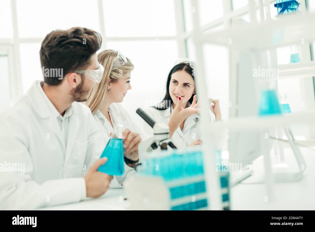 rear view.a group of scientists working in a modern laboratory Stock ...