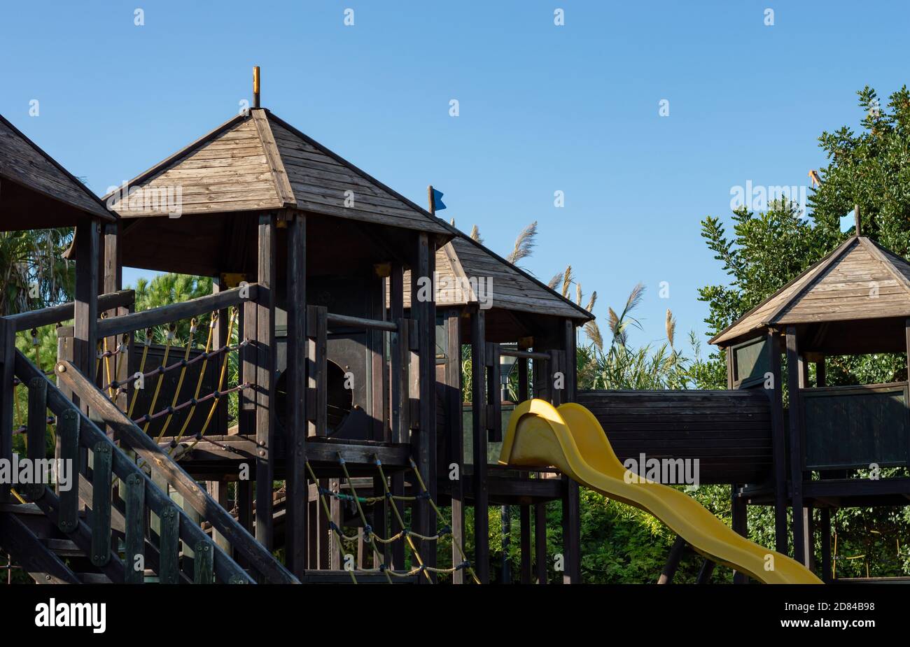 wooden playground with a slide Stock Photo - Alamy