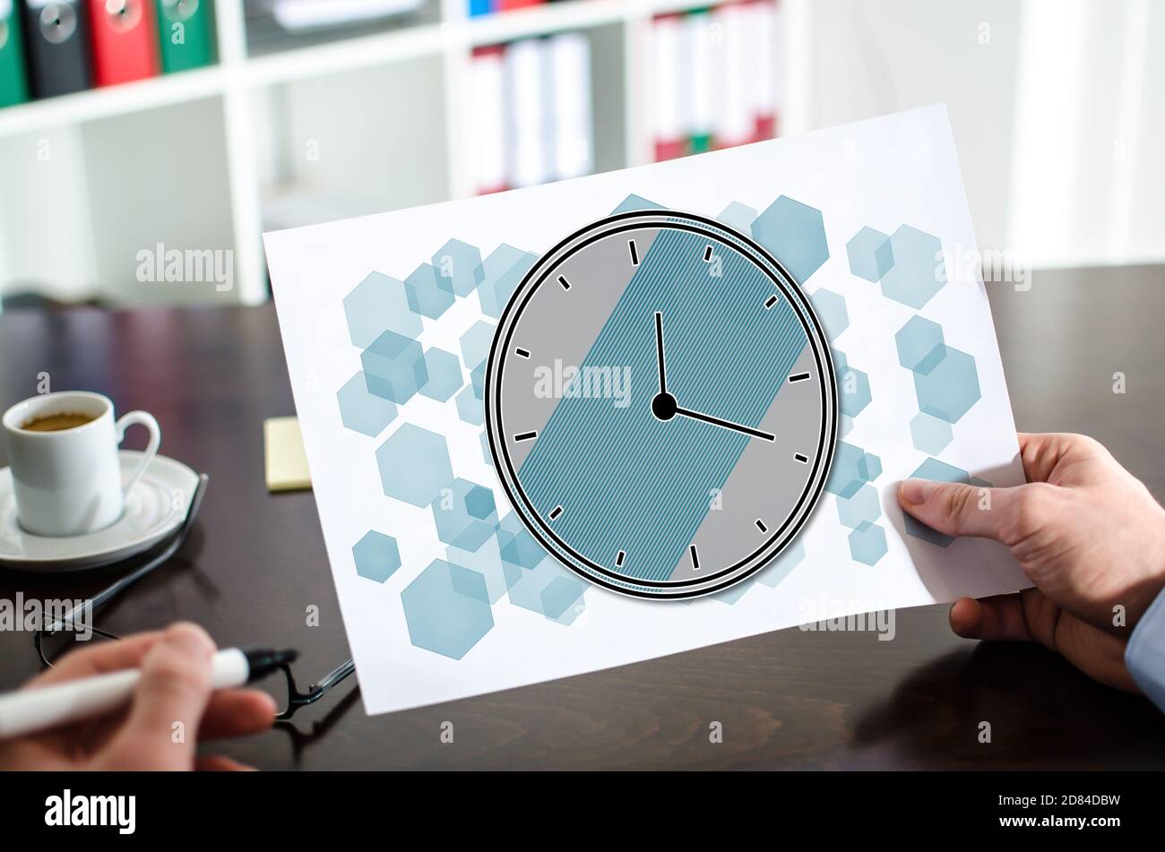 Hand holding a paper showing time management concept Stock Photo - Alamy