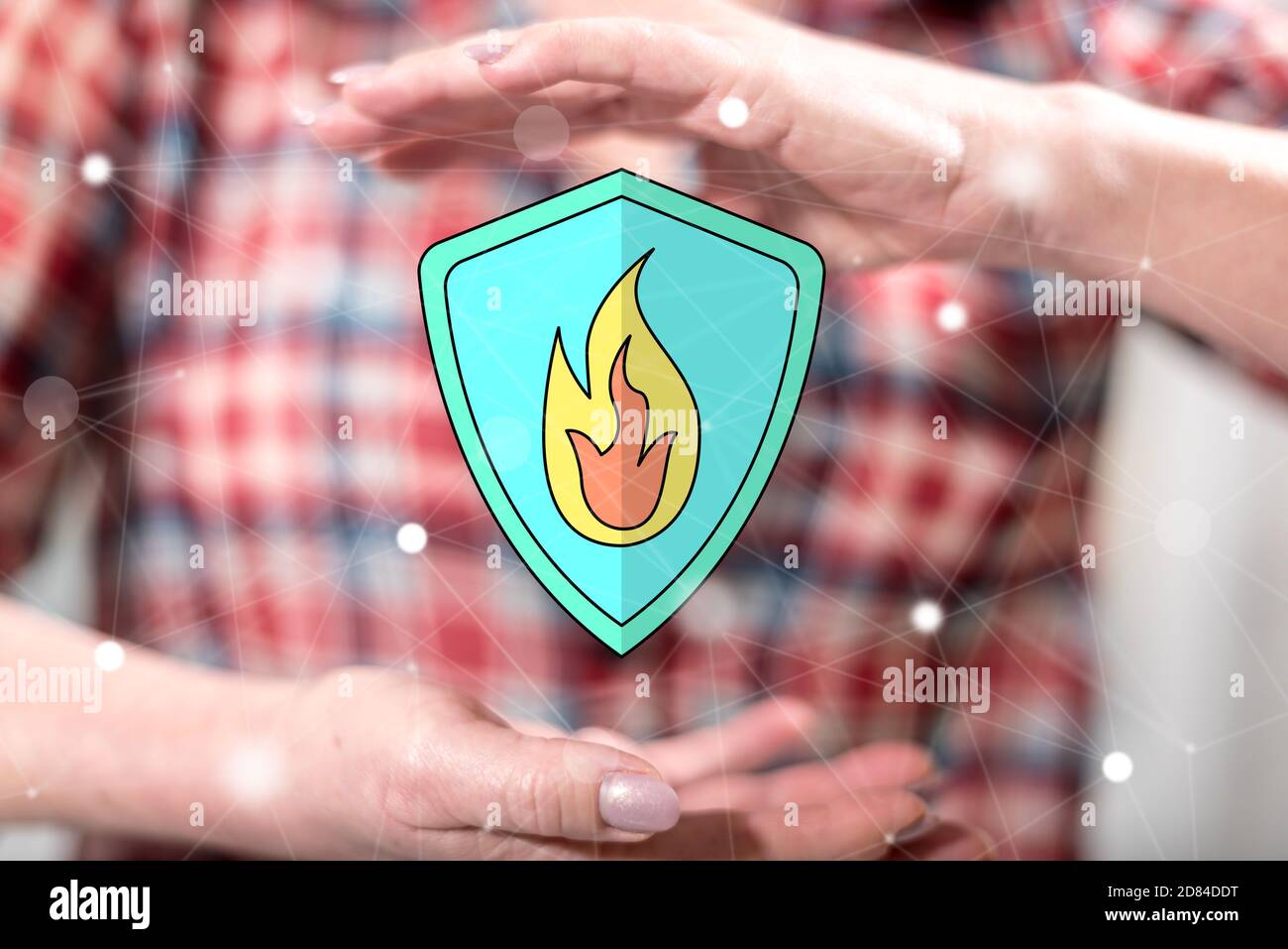 Fire protection concept between hands of a woman in background Stock ...
