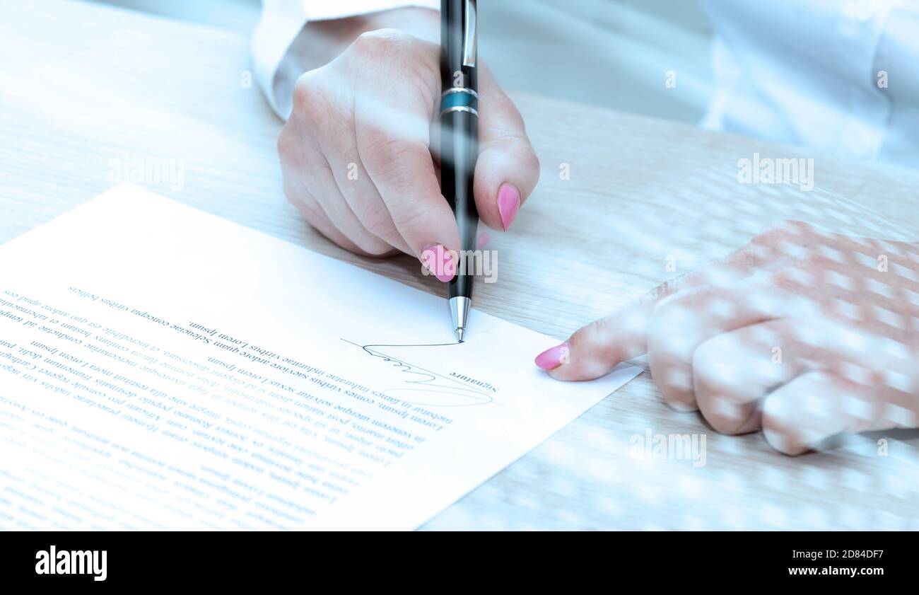 Woman signing a legal document; multiple exposure Stock Photo - Alamy