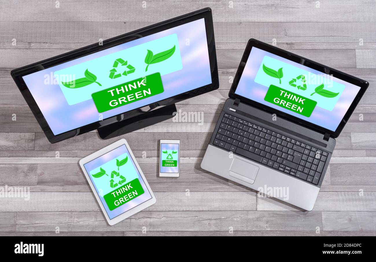 Think green concept shown on different information technology devices ...