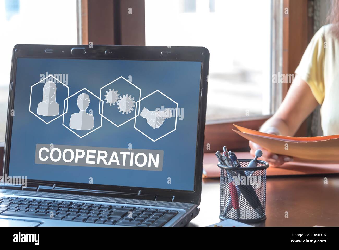 Laptop screen displaying a cooperation concept Stock Photo - Alamy