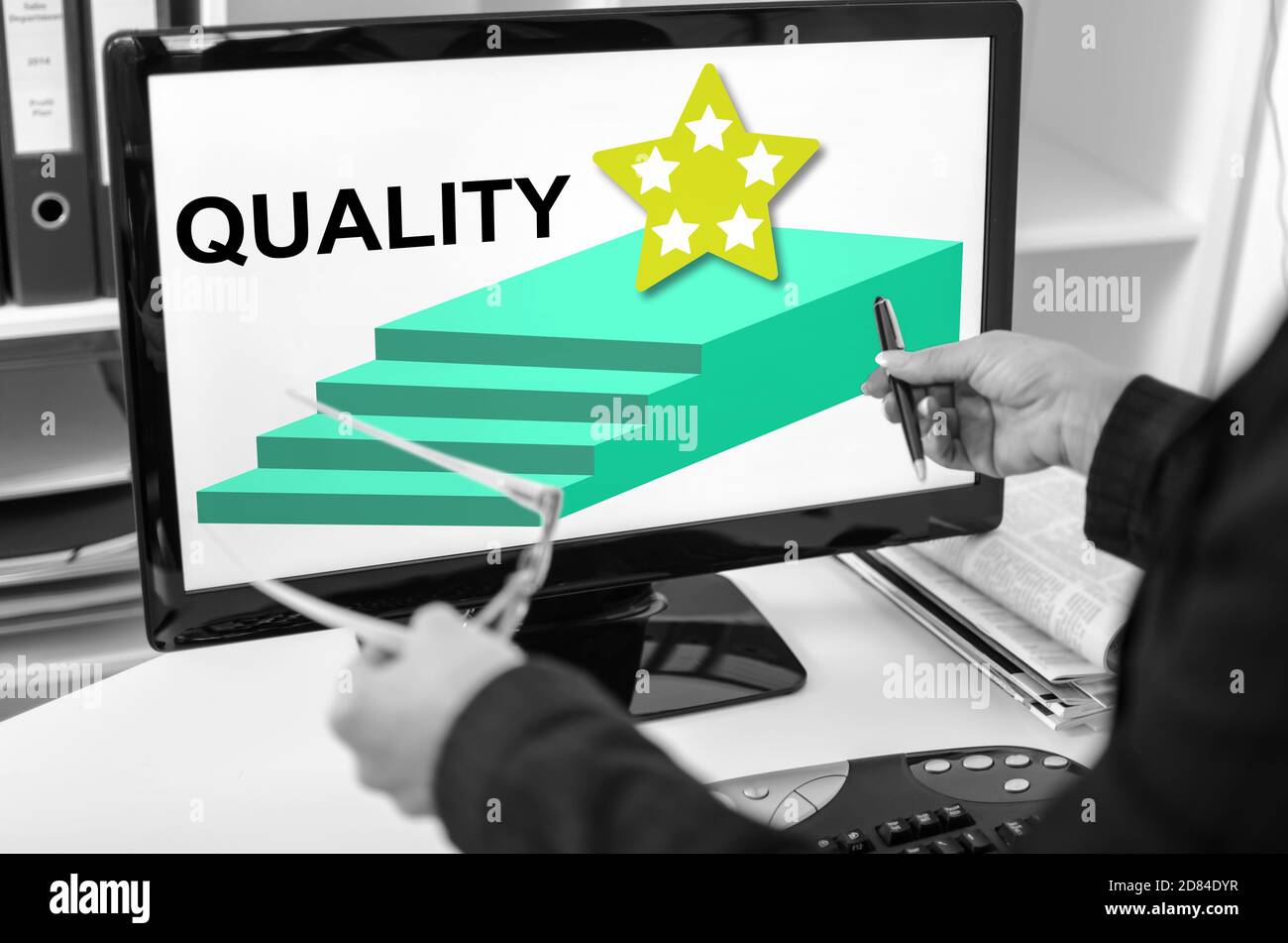 Businesswoman showing quality concept on a computer screen Stock Photo ...