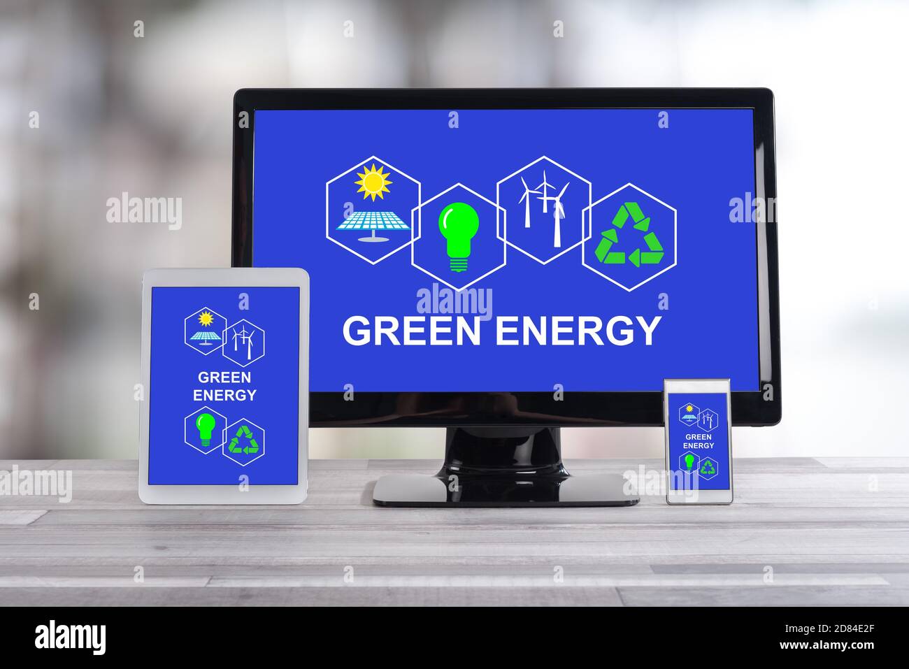 Green energy concept shown on different information technology devices ...