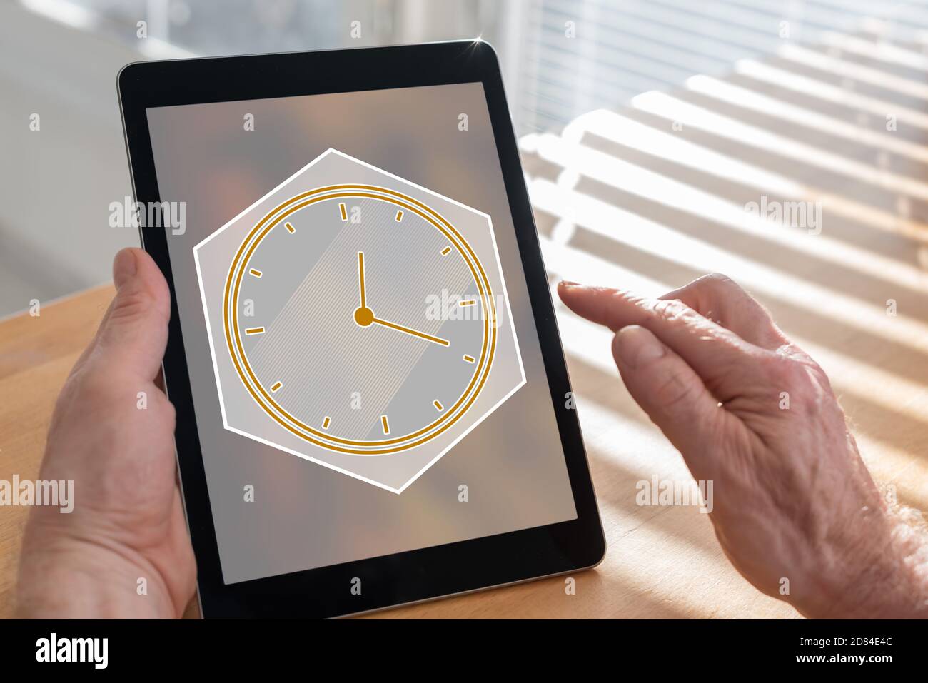 Tablet screen displaying a time management concept Stock Photo - Alamy