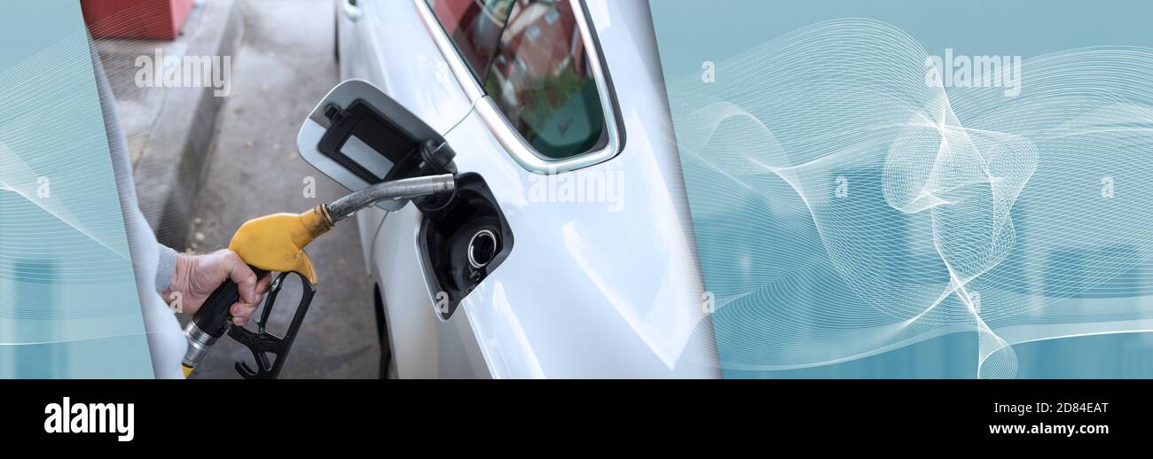 Man holding an yellow fuel pump nozzle. panoramic banner Stock Photo ...