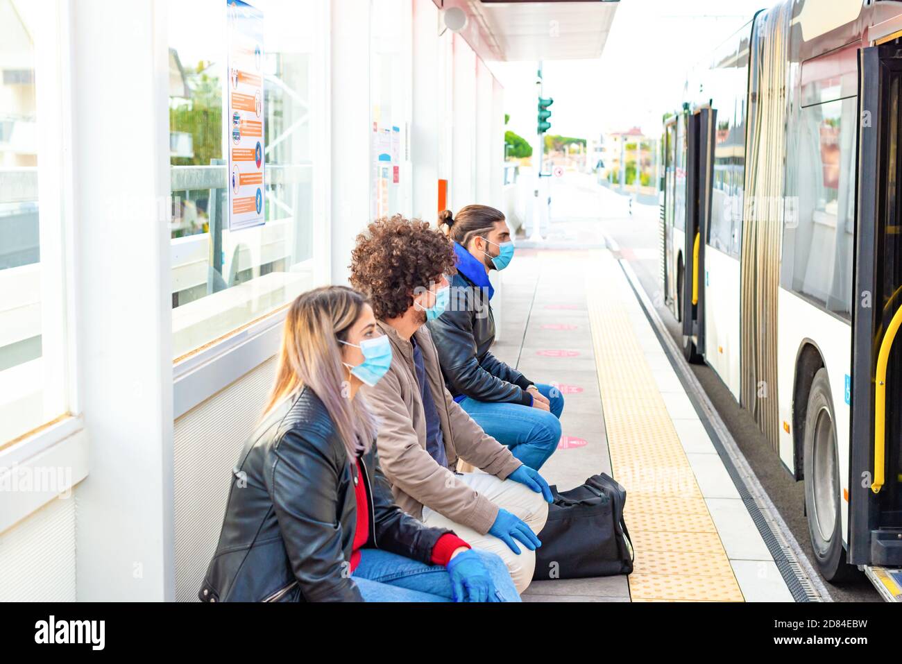 Boy and girl at bus stop hi-res stock photography and images - Alamy