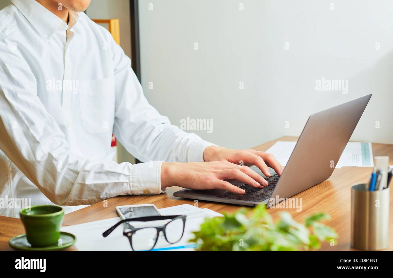 Japanese man working from home Stock Photo - Alamy