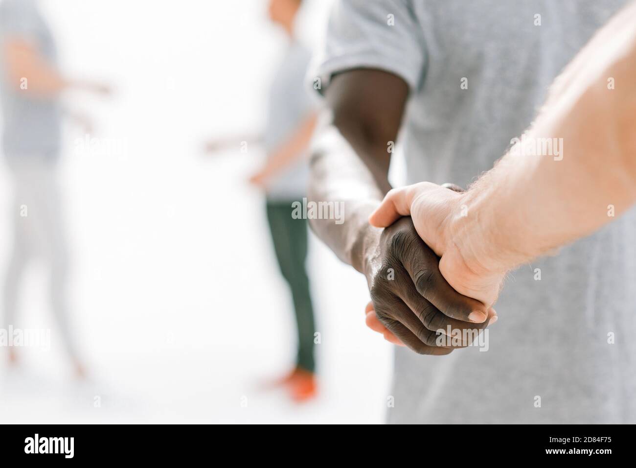 close up. welcome handshake of young people Stock Photo - Alamy