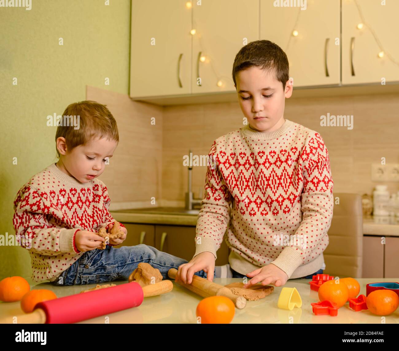Boys making cookies hi-res stock photography and images - Alamy