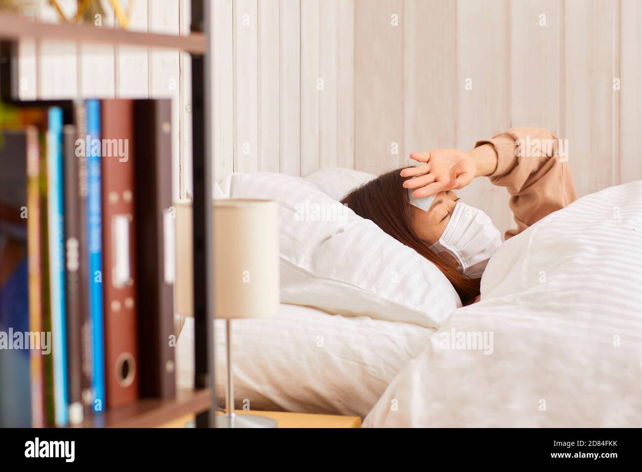 Sick Japanese woman at home Stock Photo - Alamy