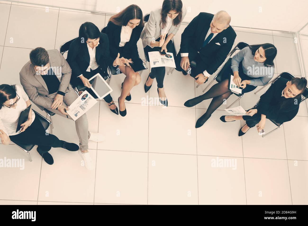 top view. the project Manager and the working group discussing ...