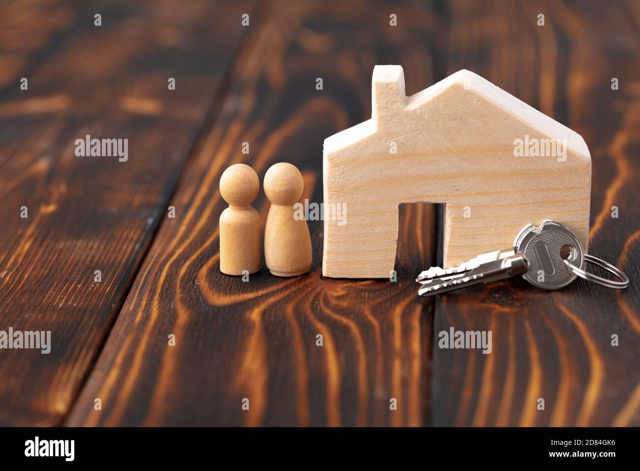 Wooden men figures and toy wooden house Stock Photo - Alamy