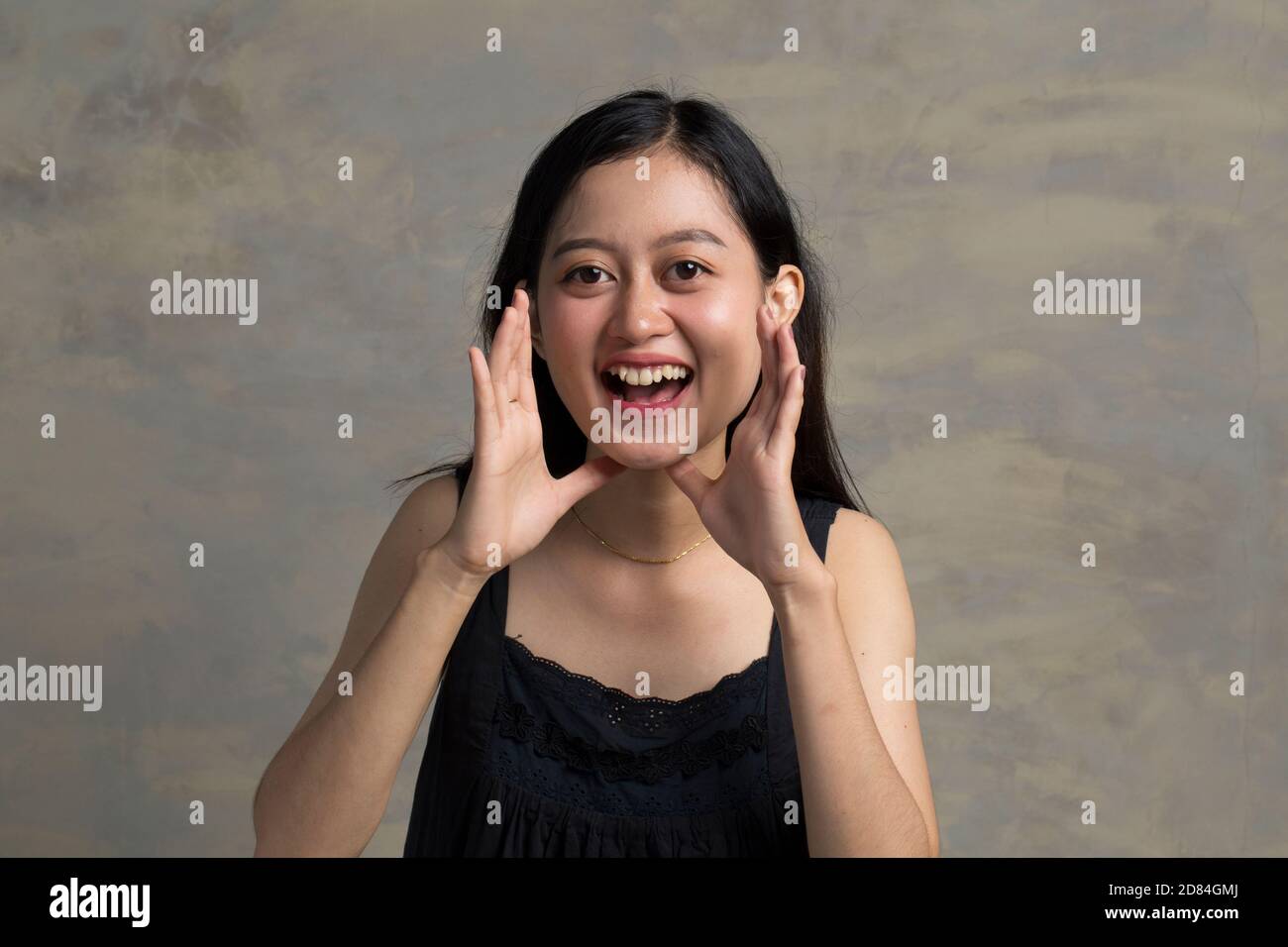 Beautiful Asian woman announcing Stock Photo - Alamy