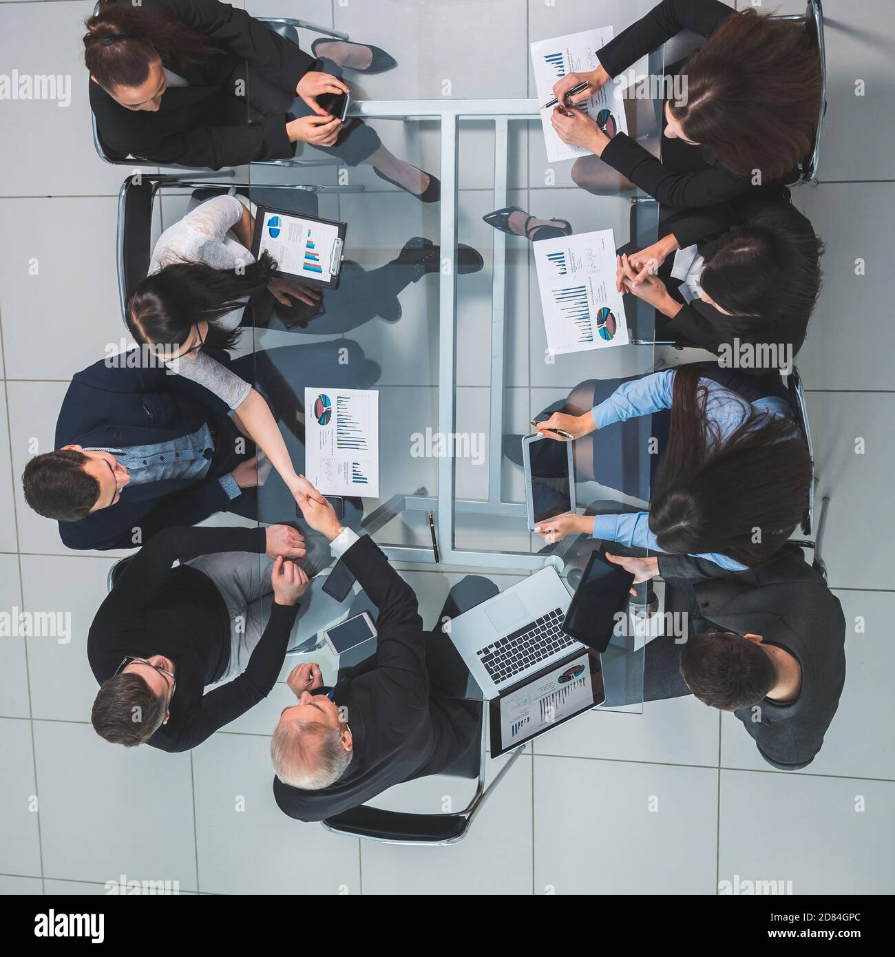 top view. handshake of financial partners at a working meeting Stock ...