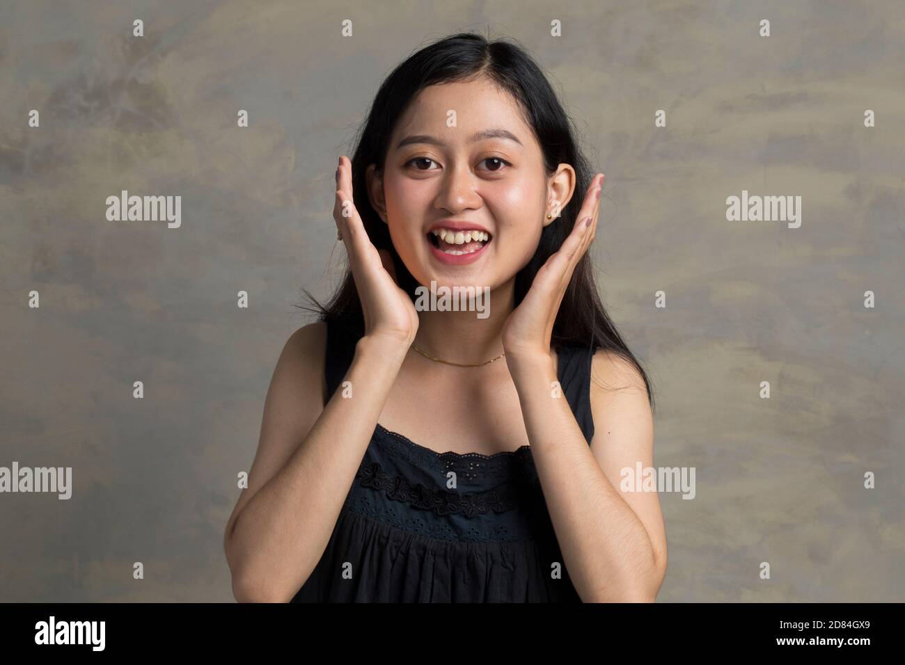 Beautiful Asian woman announcing Stock Photo - Alamy