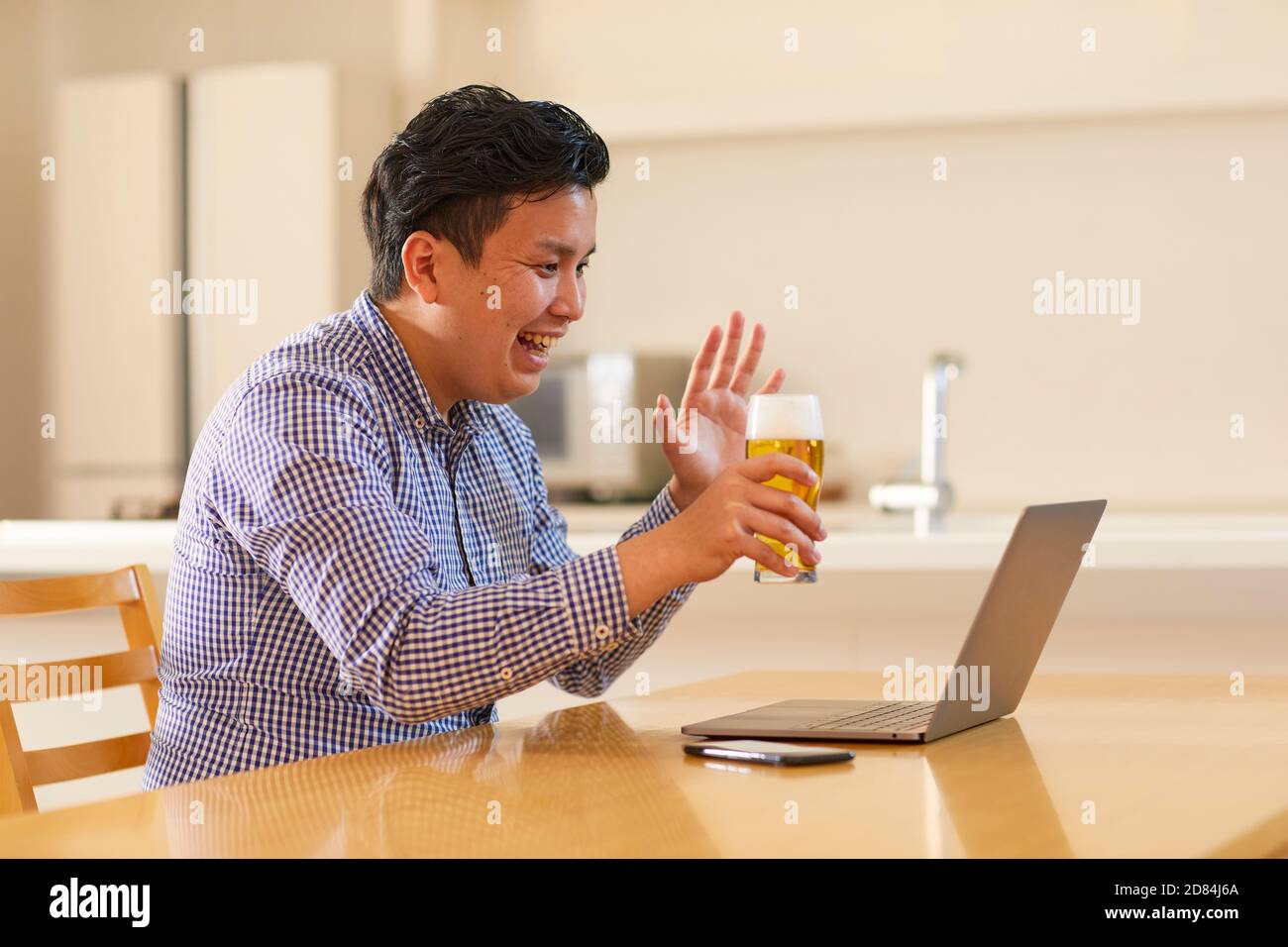 Japanese man drinking at home remote drinking Stock Photo - Alamy