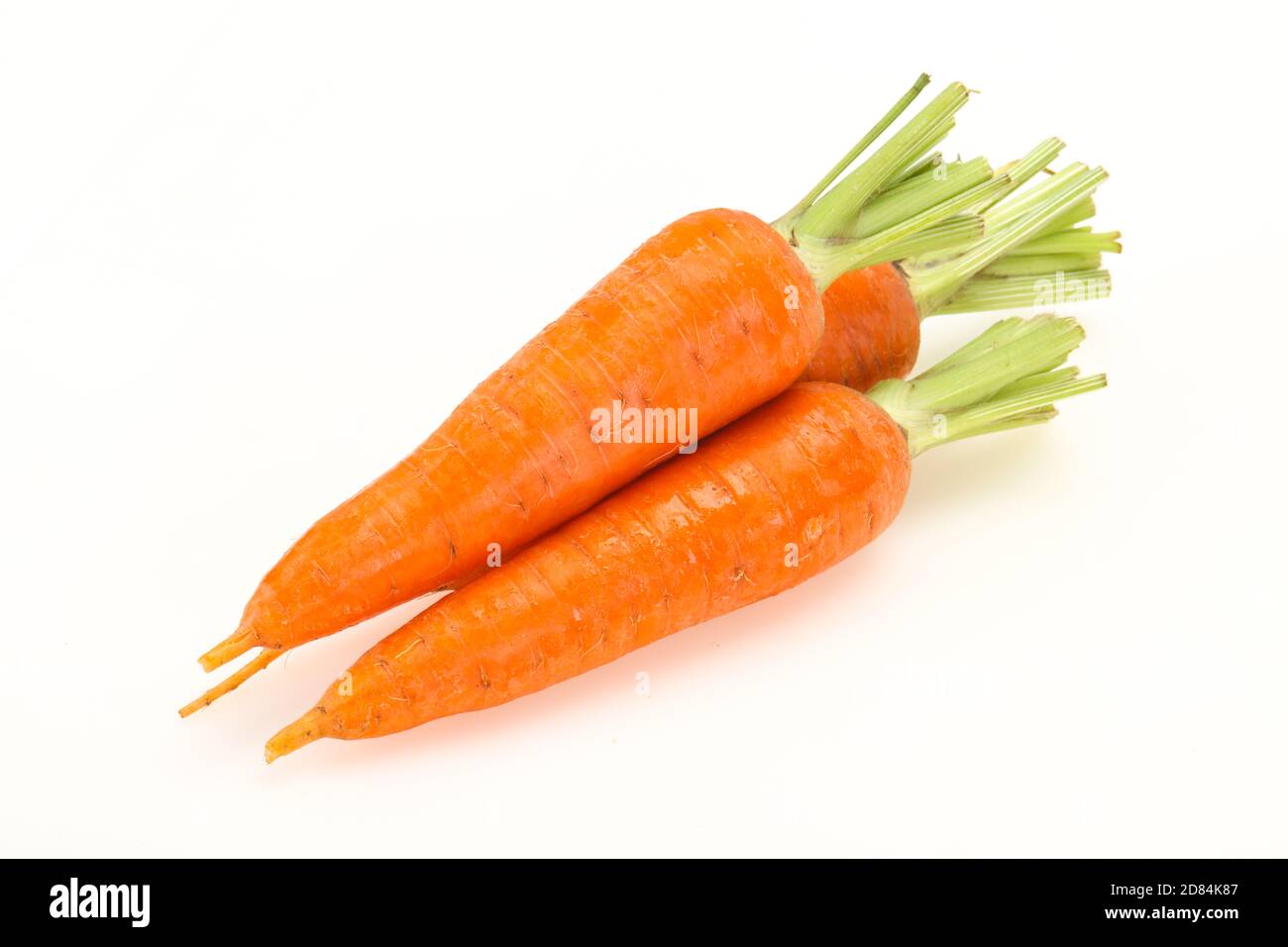 Three Young fresh ripe carrots Stock Photo - Alamy