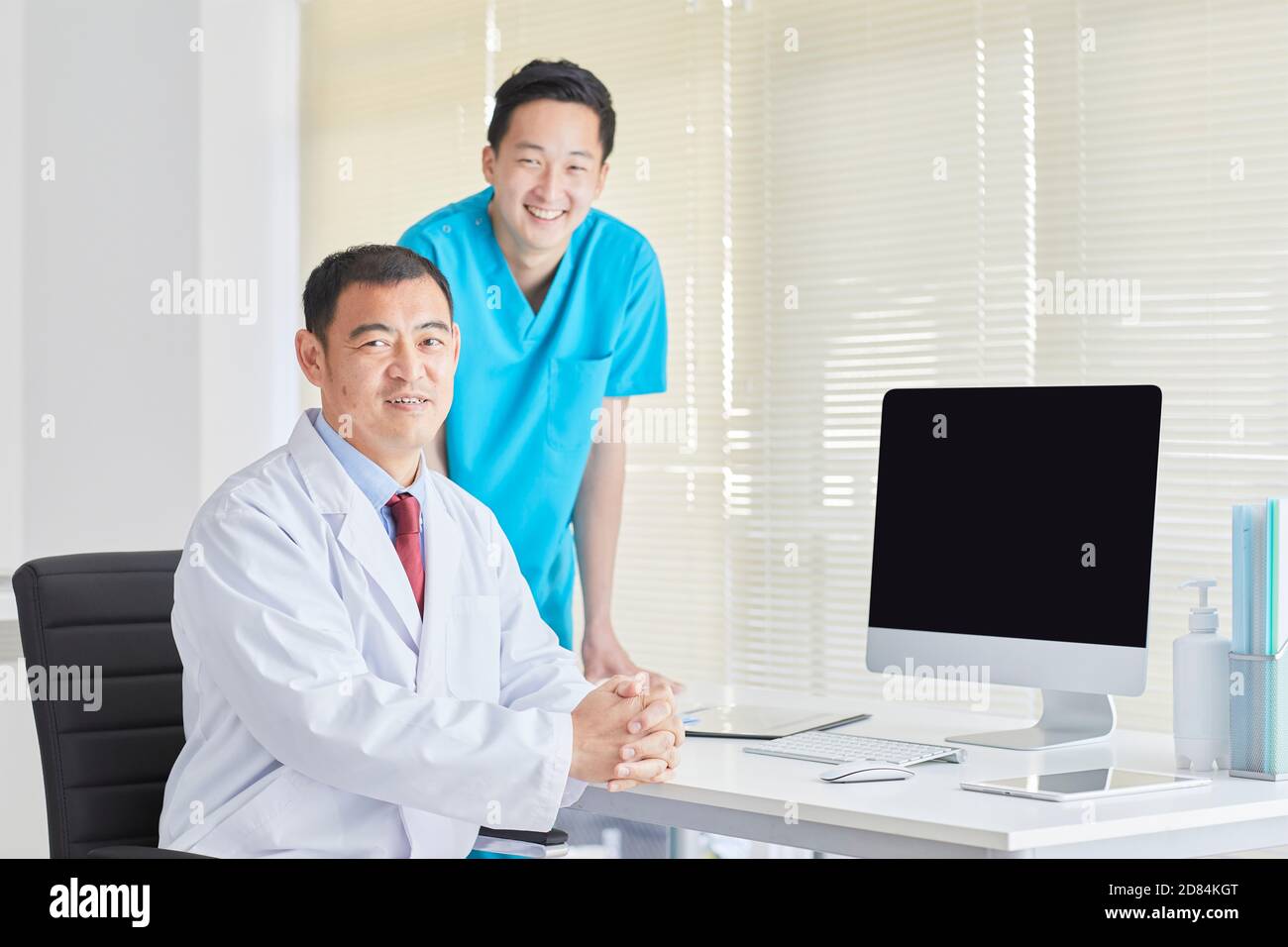 Two male doctors stand in hi-res stock photography and images - Alamy