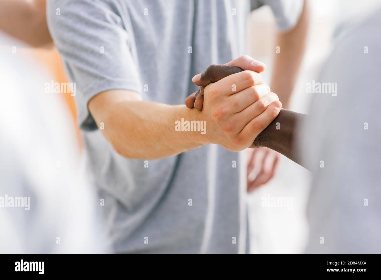 close up. handshake students at the international forum Stock Photo - Alamy