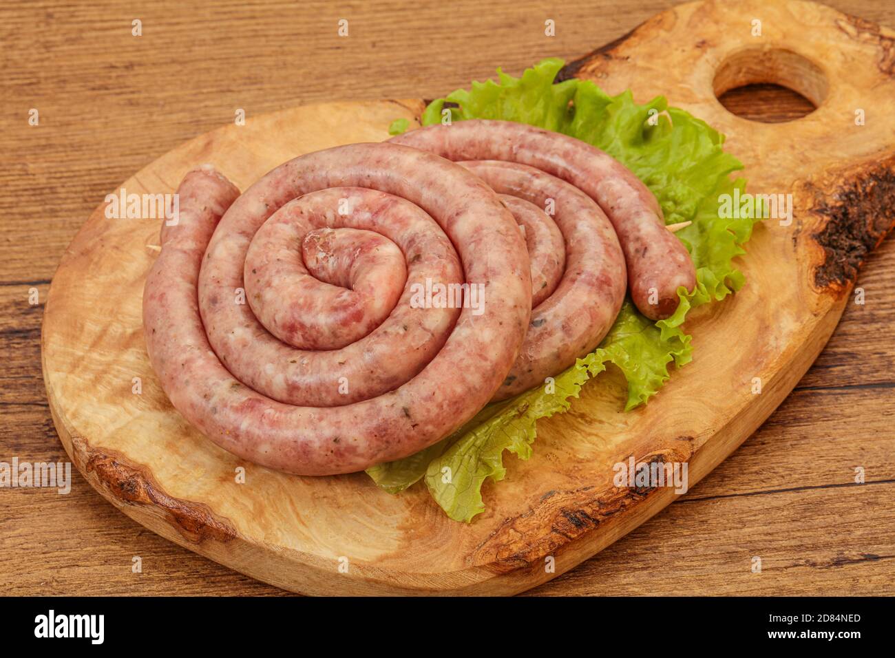Raw pork sausage ring for grill Stock Photo - Alamy