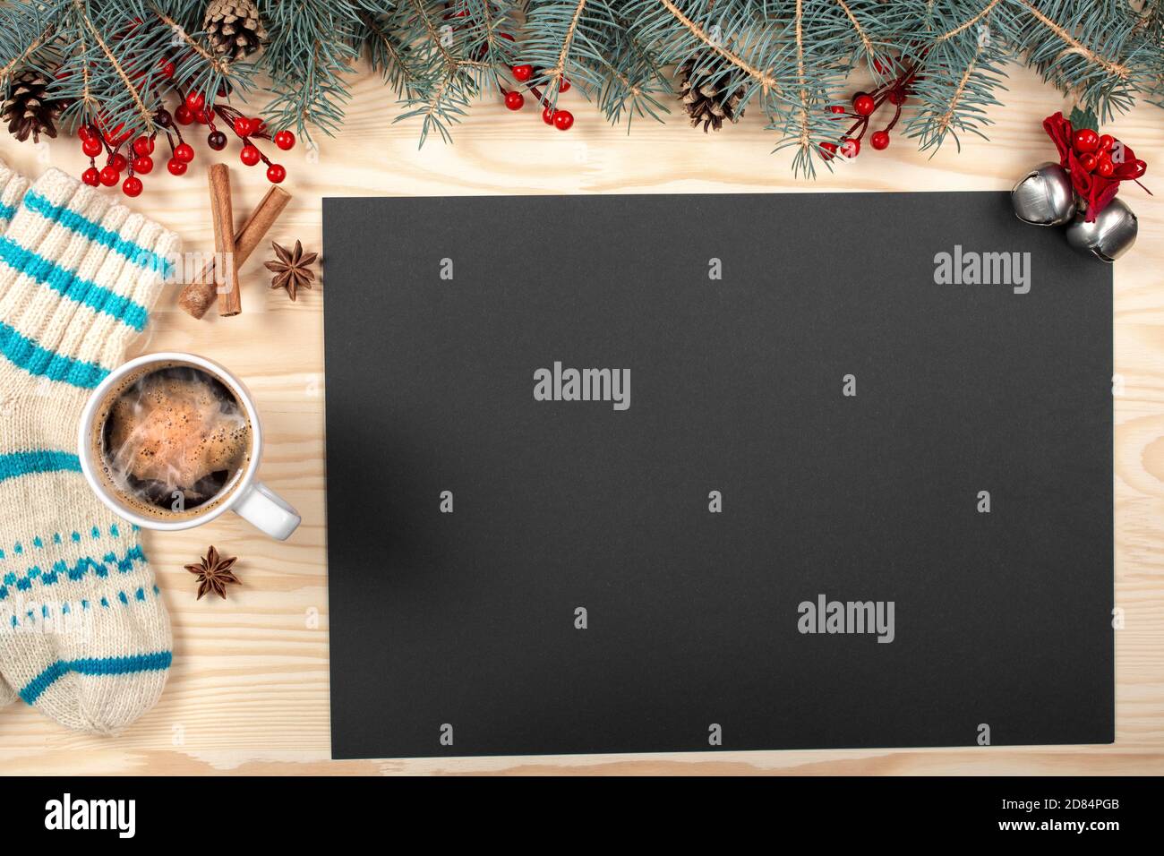 Christmas mockup with a black sheet of a3 size paper with Christmas ...