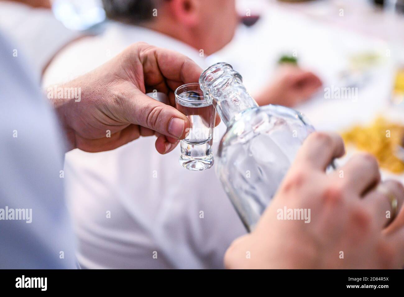 Vodka glass hand hi-res stock photography and images - Alamy