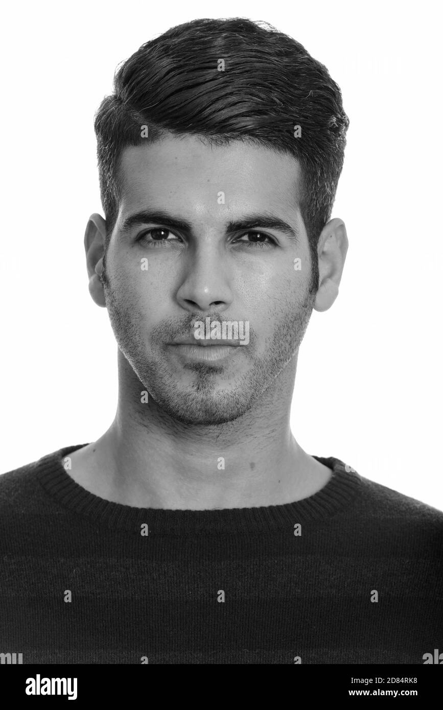 Face of young handsome Persian man with beard stubble Stock Photo - Alamy