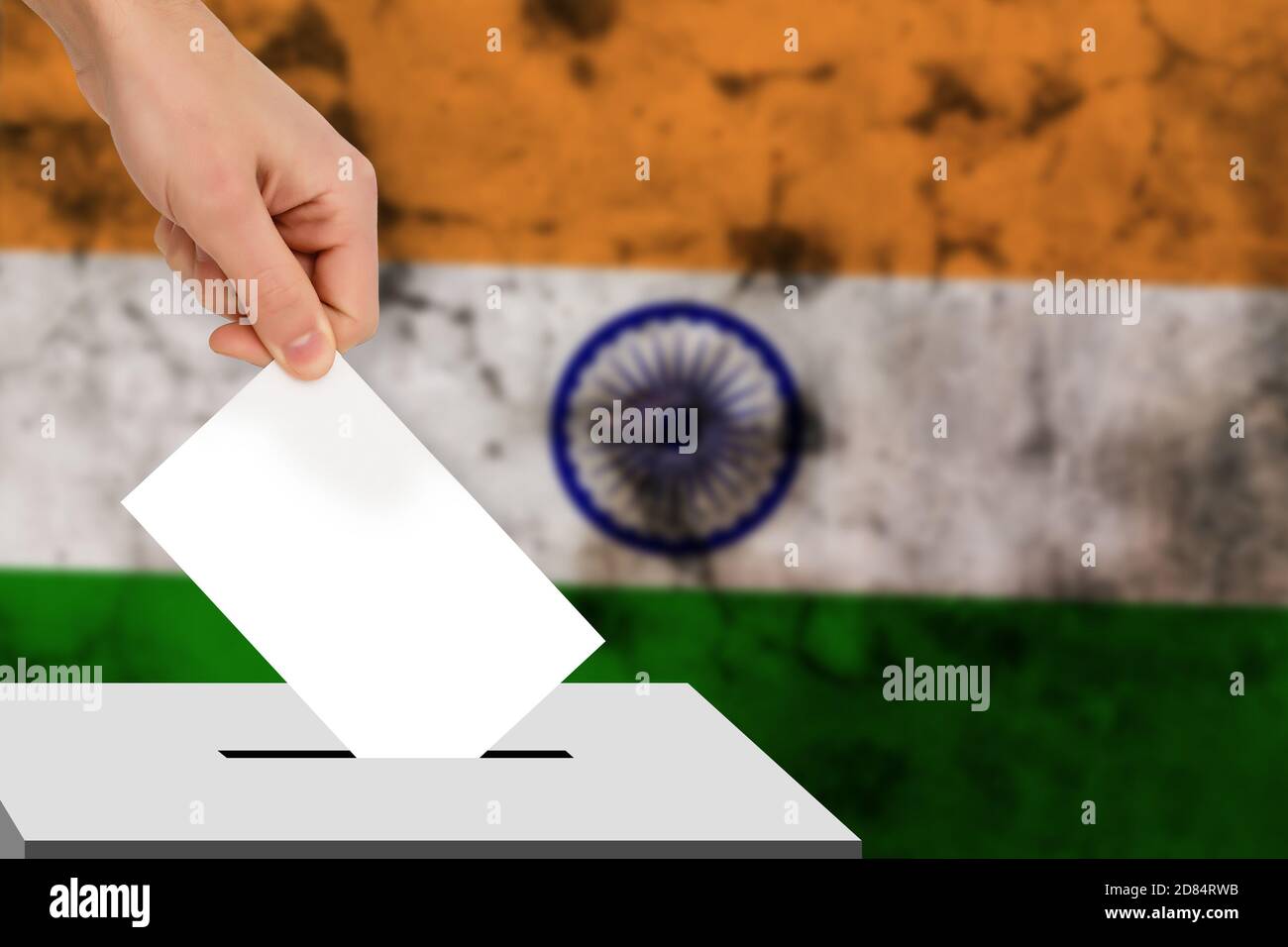 hand drops the ballot election against the background of the flag ...