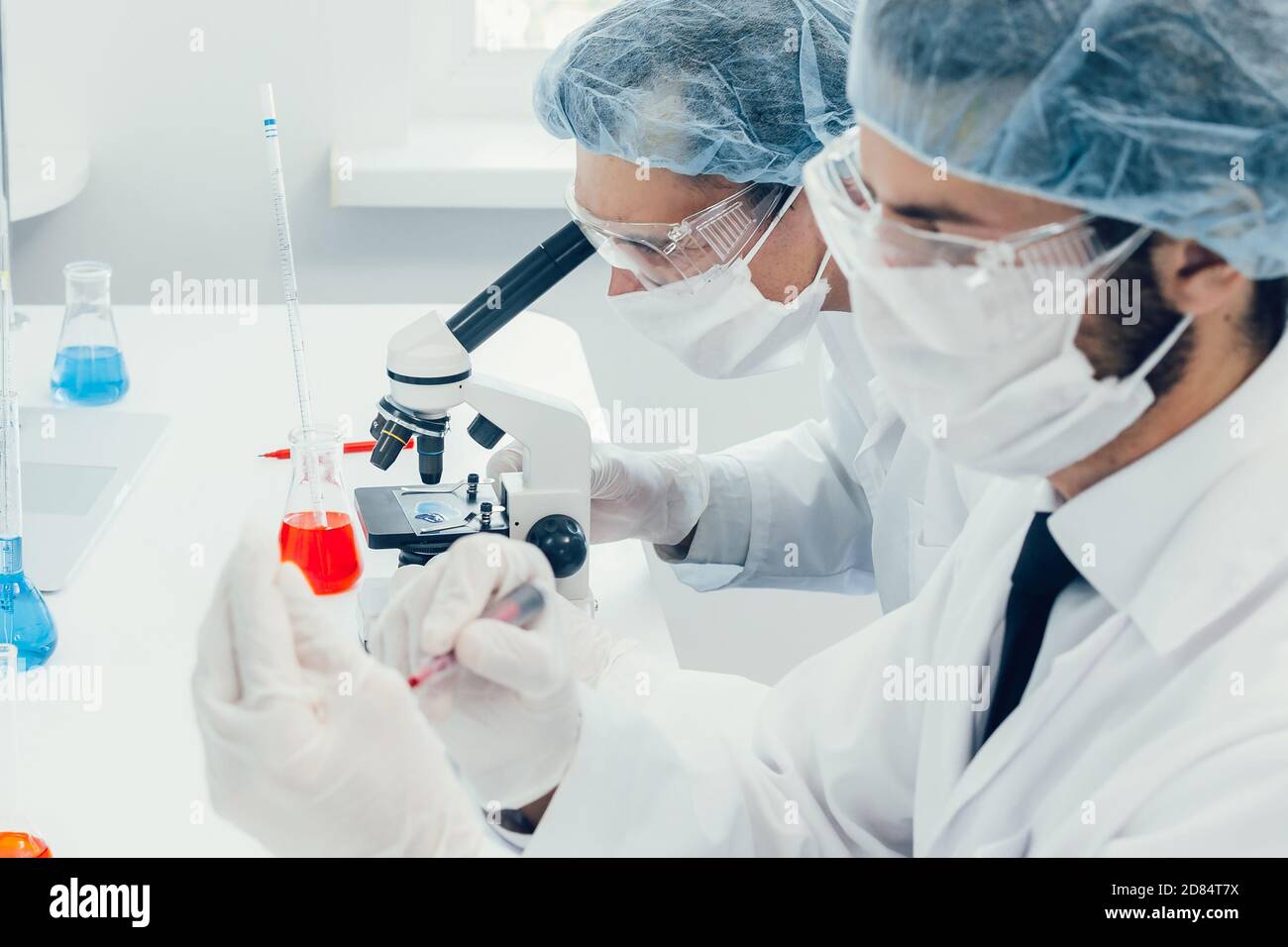 close up. scientist testing blood in the lab Stock Photo - Alamy