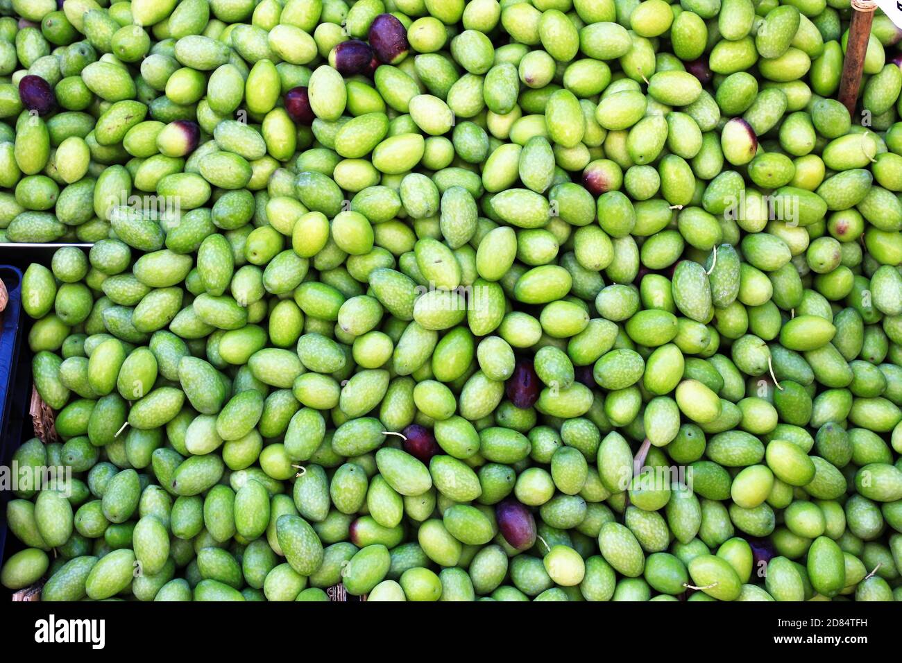 Stall with green olives at street market in Athens, Greece Stock Photo ...