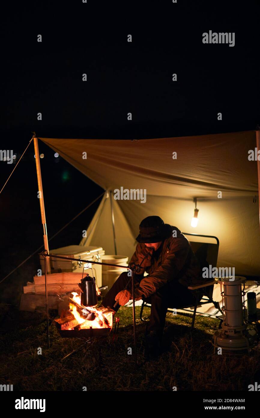 Japanese man solo camping Stock Photo - Alamy
