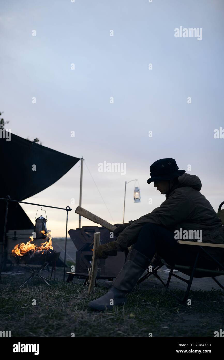 Japanese man solo camping Stock Photo - Alamy
