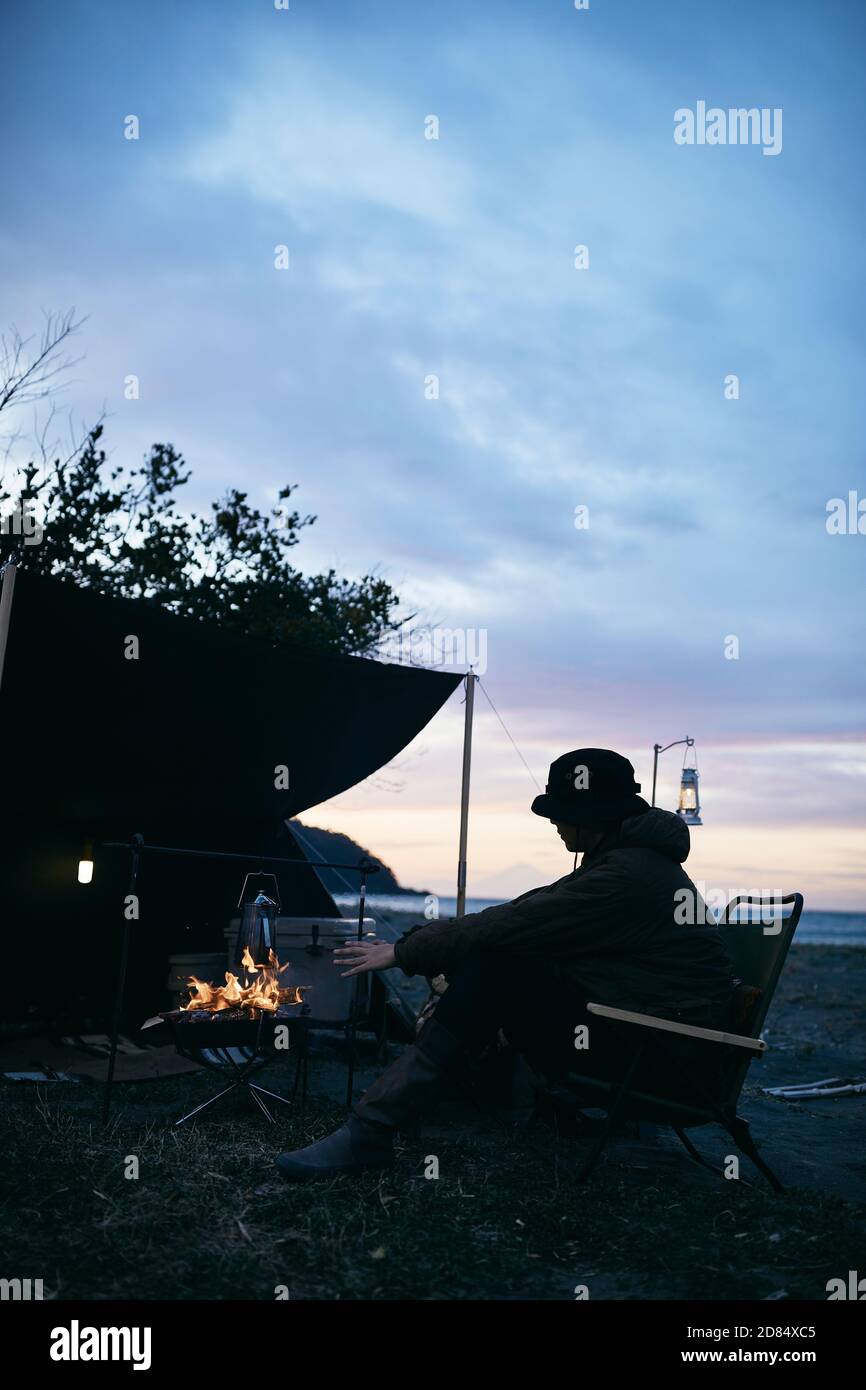 Japanese man solo camping Stock Photo - Alamy