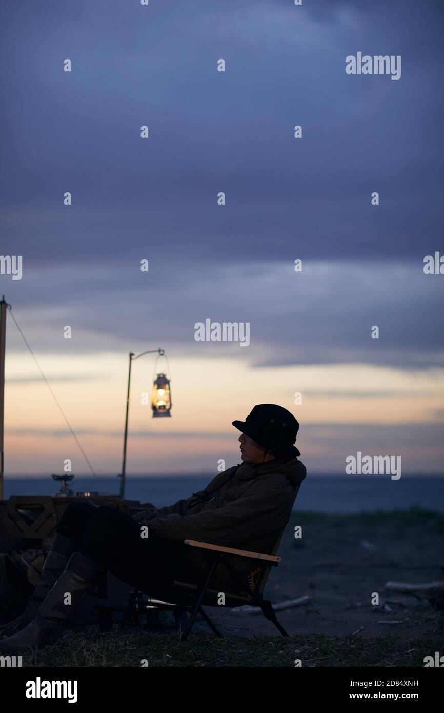 Japanese man solo camping Stock Photo - Alamy