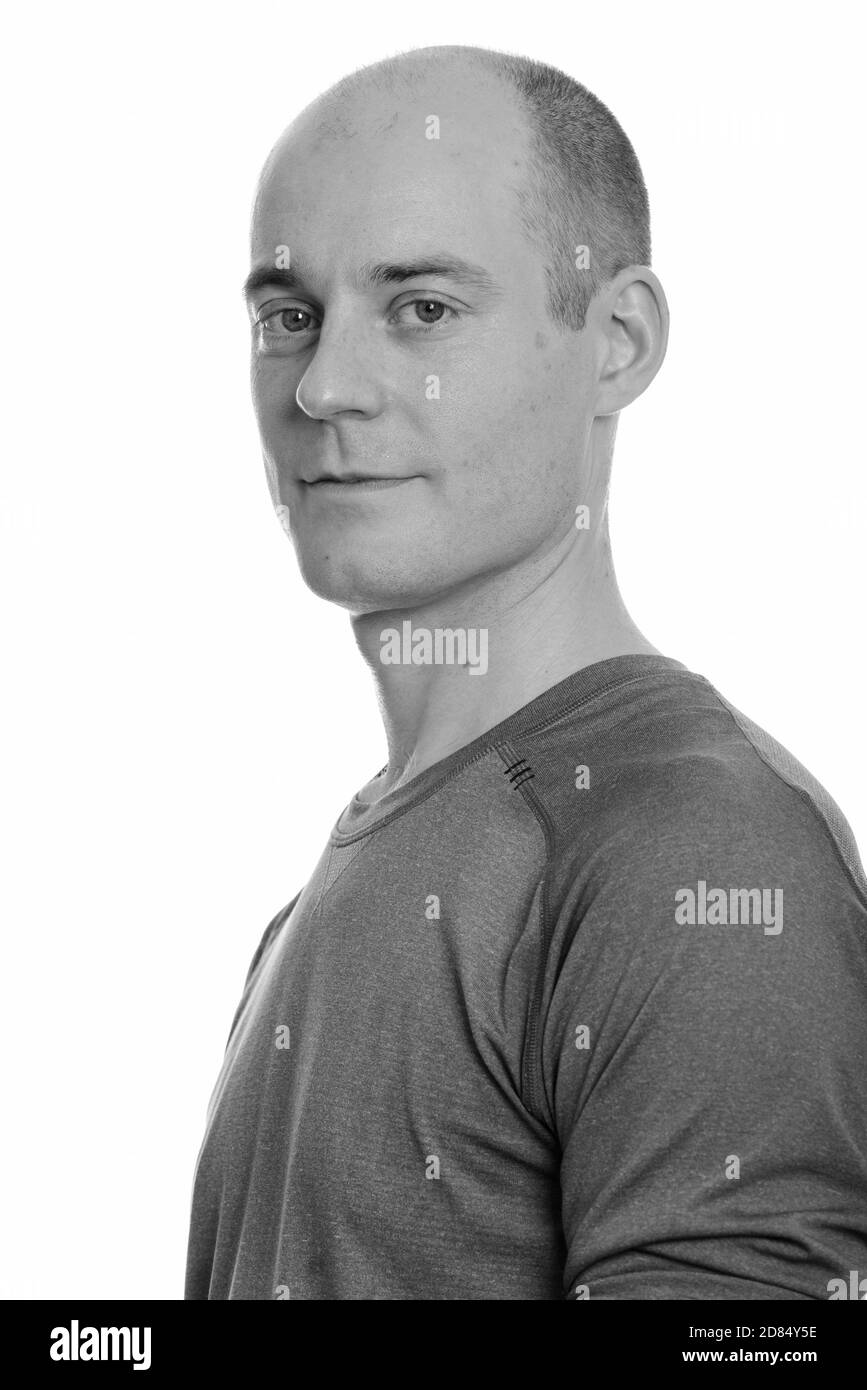 Profile view of handsome bald man looking at camera Stock Photo - Alamy