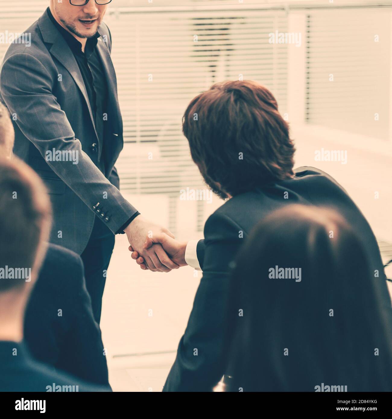 business colleagues greeting each other with a handshake Stock Photo ...