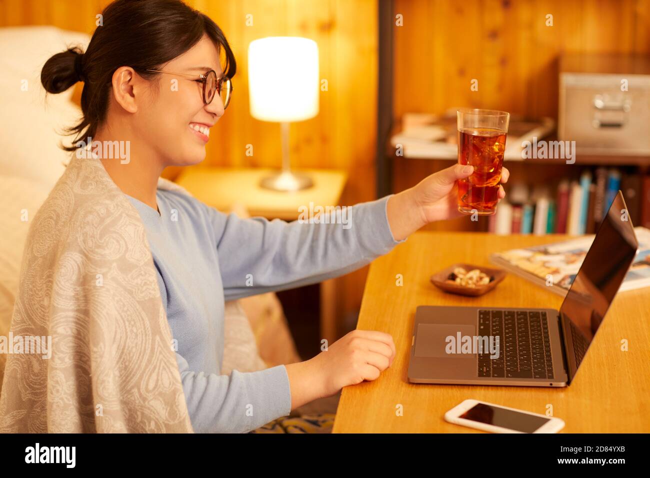 Japanese woman drinking at home remote drinking Stock Photo - Alamy