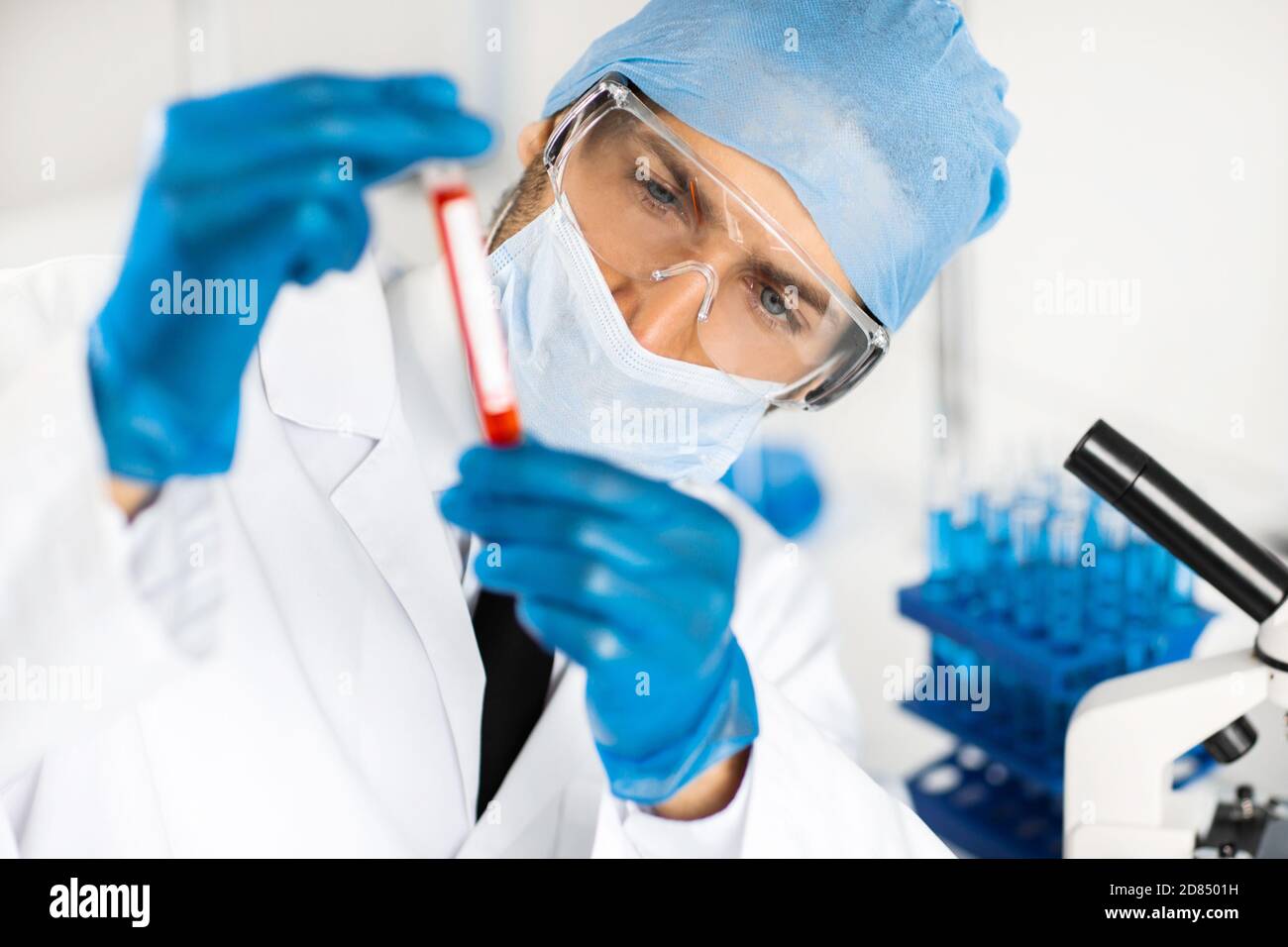 close up. test tube in the hands of a laboratory assistant Stock Photo ...