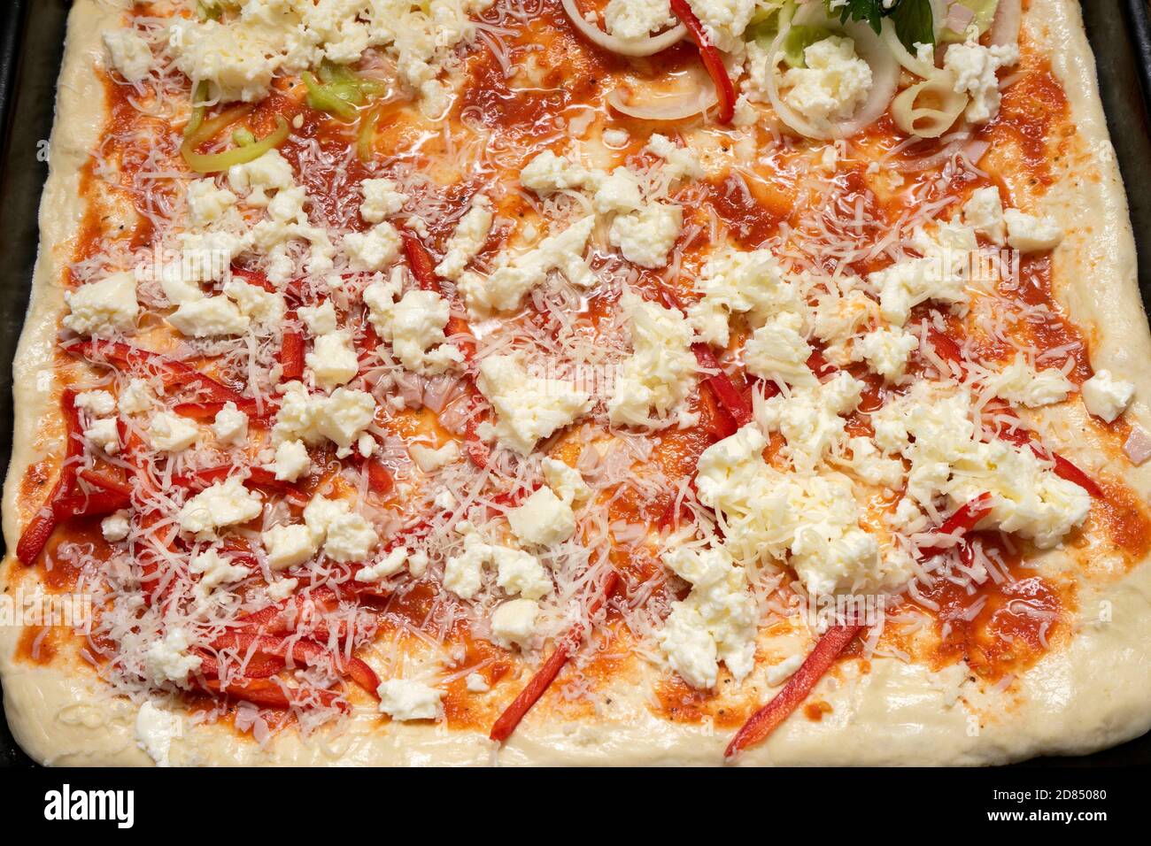 Homemade pizza ready to bake in oven Stock Photo - Alamy