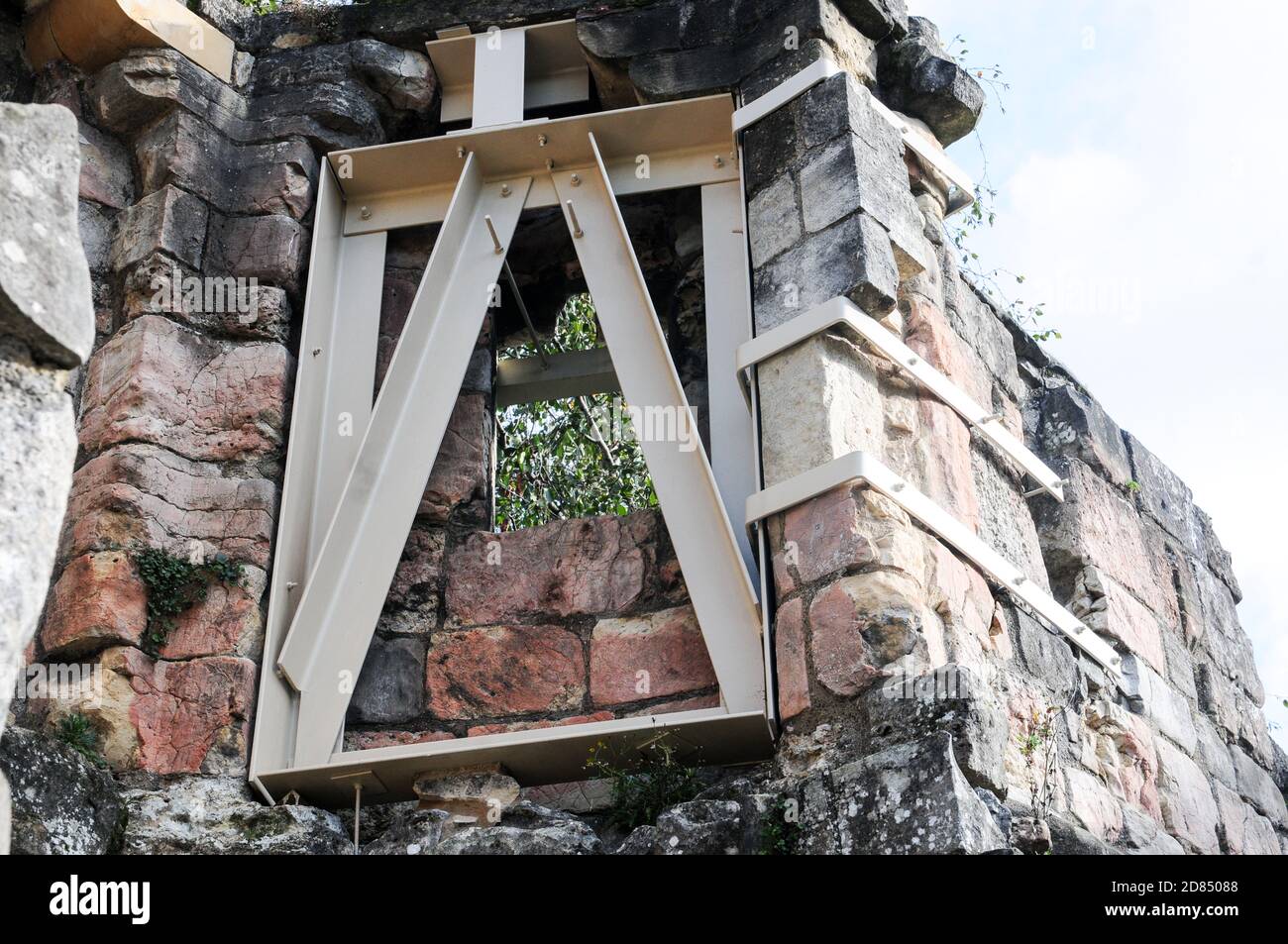 Steel frame work designed to help stop this wall from falling down in ...