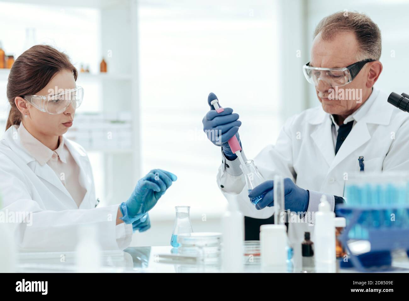 close up. scientists testing samples of a new vaccine Stock Photo - Alamy