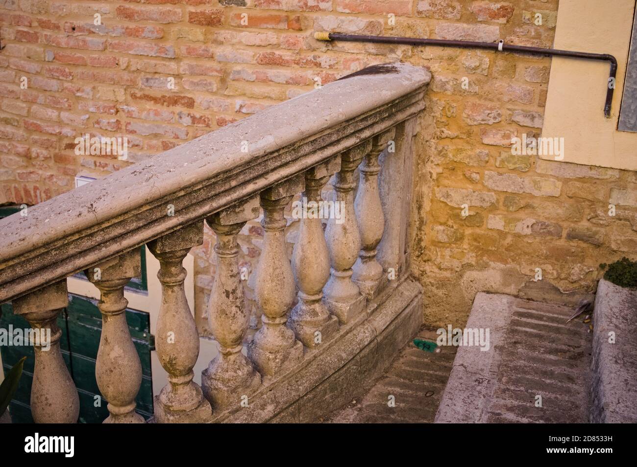Detail of a railing of a staircase in an old Italian village (Corinaldo ...