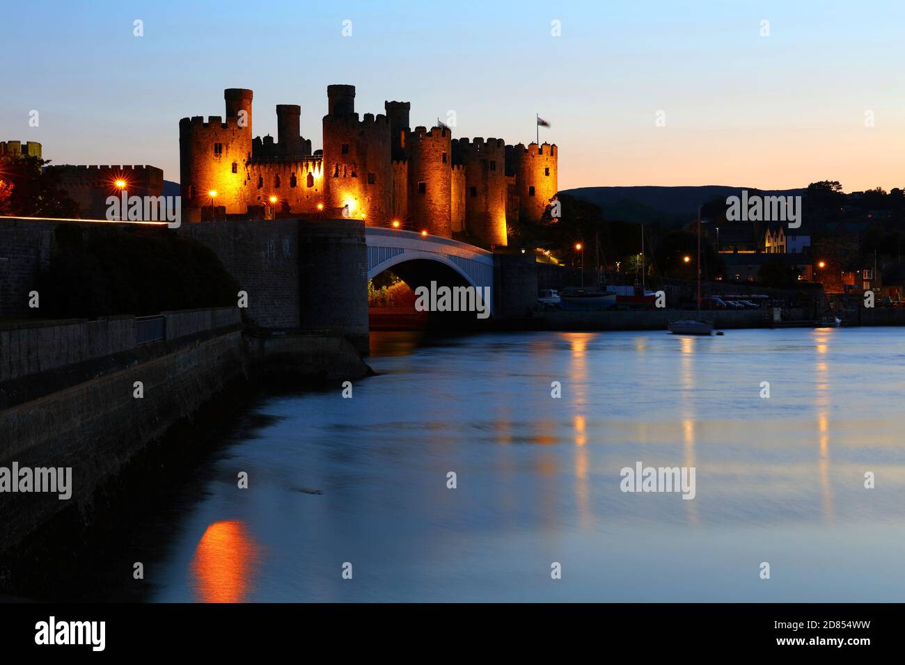 Conwy Castle floodlit against a blue Sky after Sunset, Conwy, North ...
