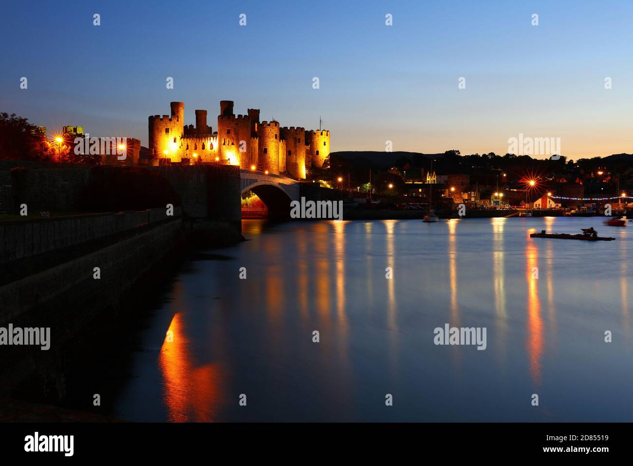 Conwy Castle floodlit against a blue Sky after Sunset, Conwy, North ...
